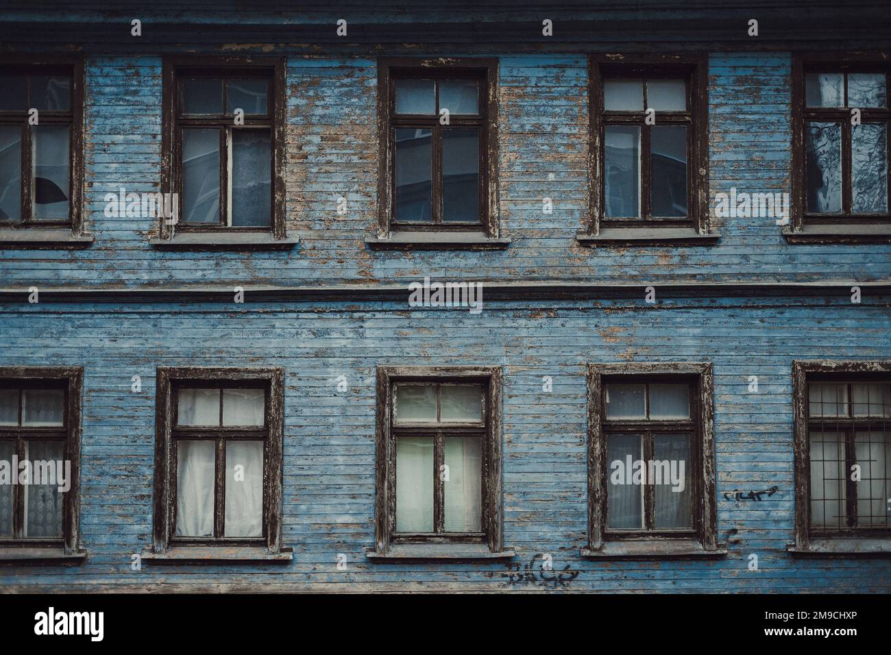 An old wooden house with closed glass windows Stock Photo - Alamy