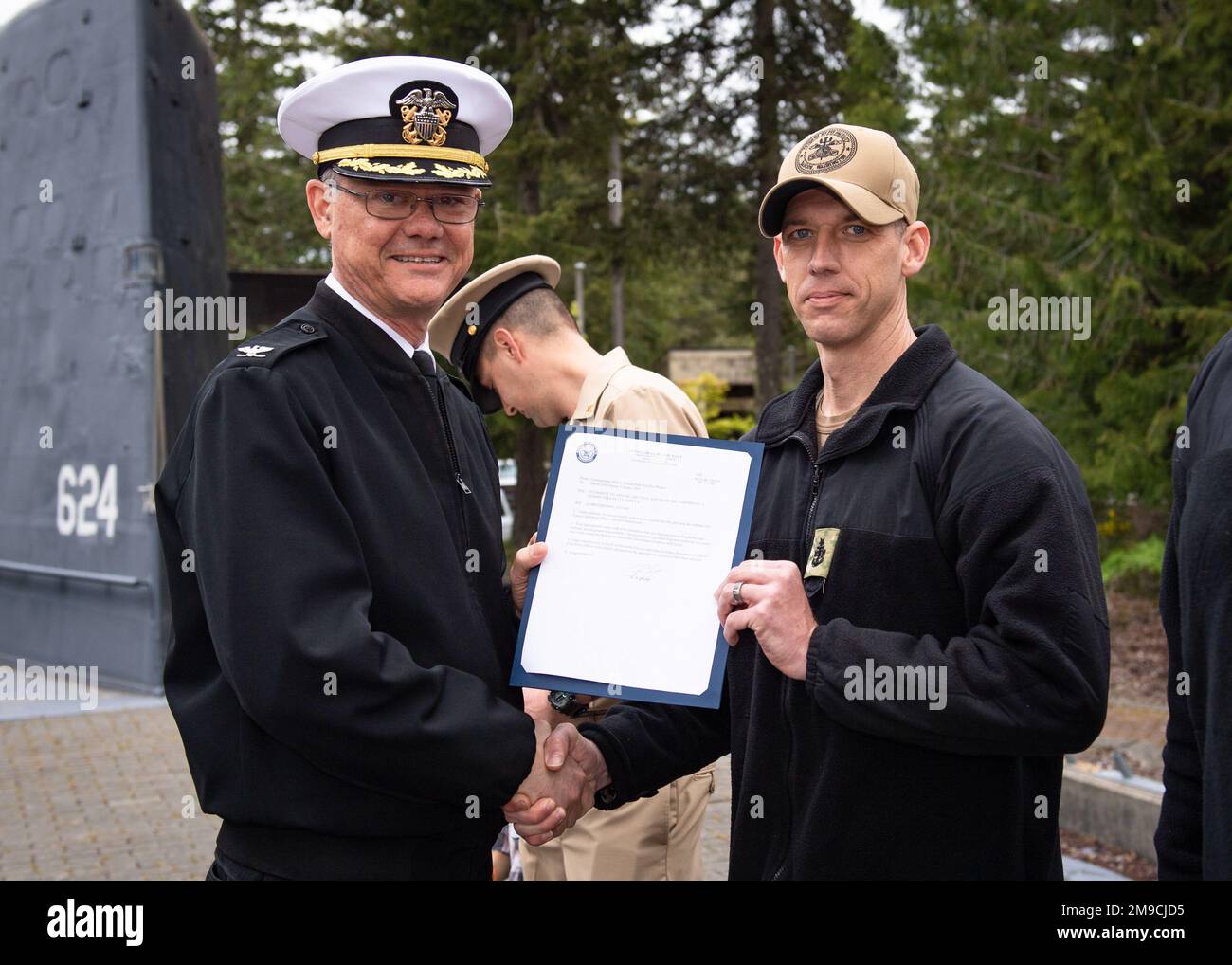 SILVERDALE, Wash. (May 16, 2022) – Capt. Robert Figgs, left, commanding ...