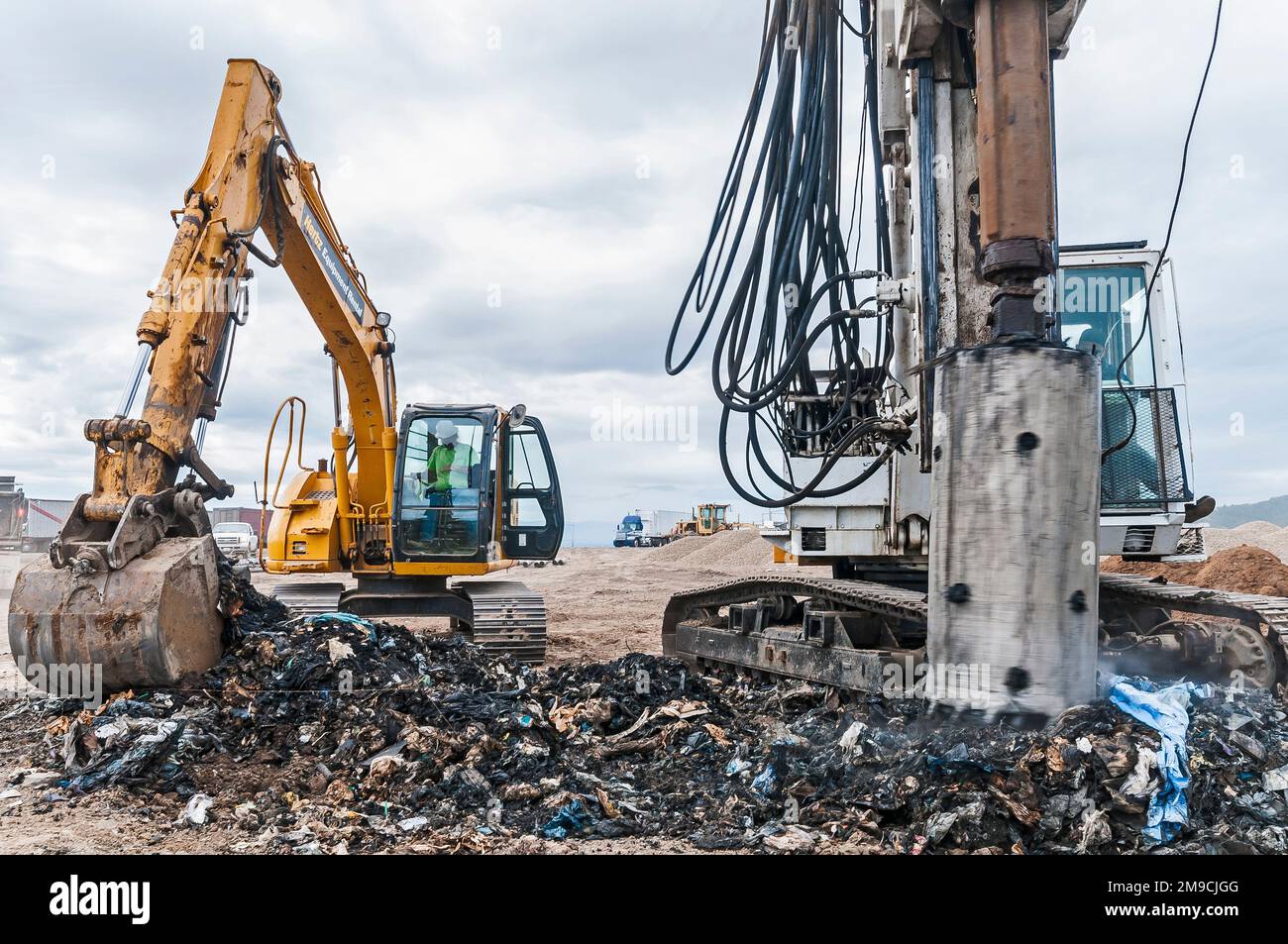 A power shovel and a methane gas well drilling rig at an active ...
