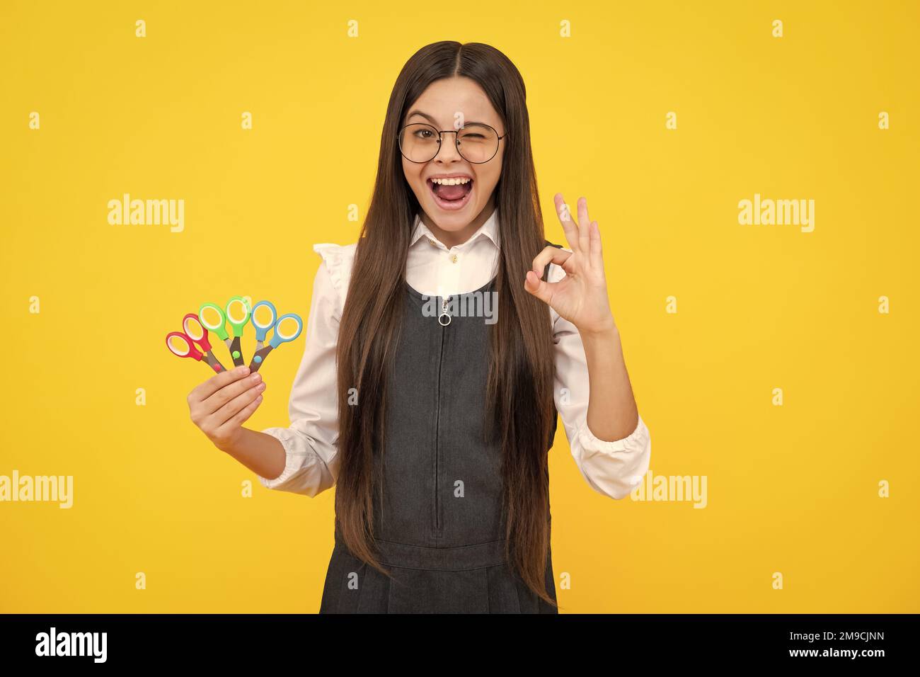 Childrens creativity, arts and crafts. Teenage girl with scissors ...