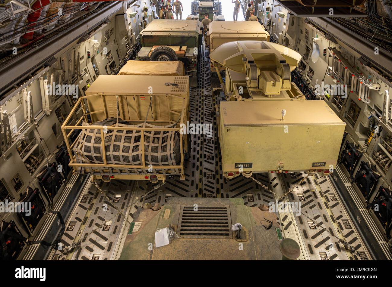 U.S. Airmen secure vehicles on a C-17 Globemaster III at Ali Al Salem ...