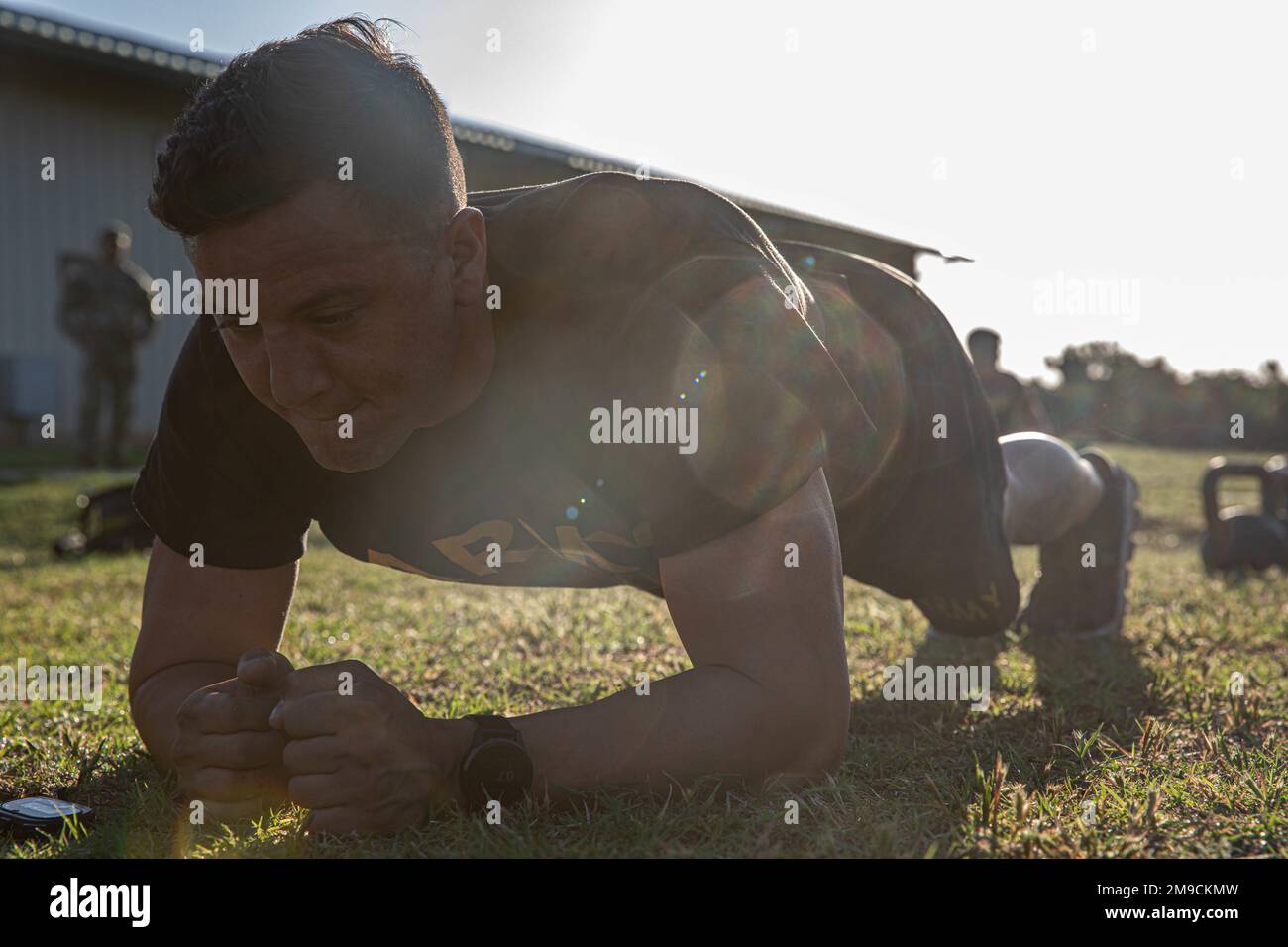 Spc. Arron Nunez, Arkansas National Guard, holds a plank during an Army ...