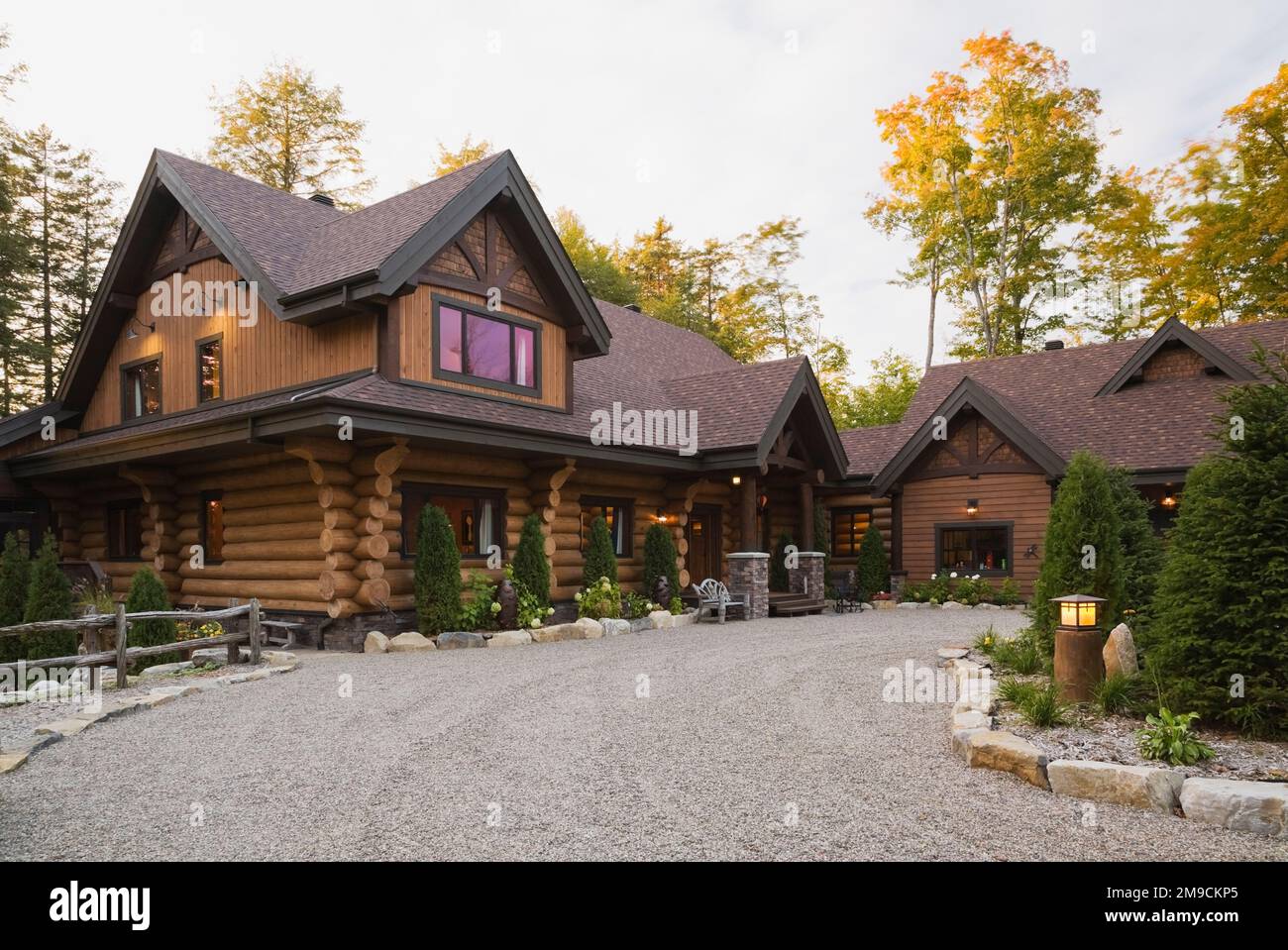 Luxurious Scandinavian log and timber style home with brown nuanced ...