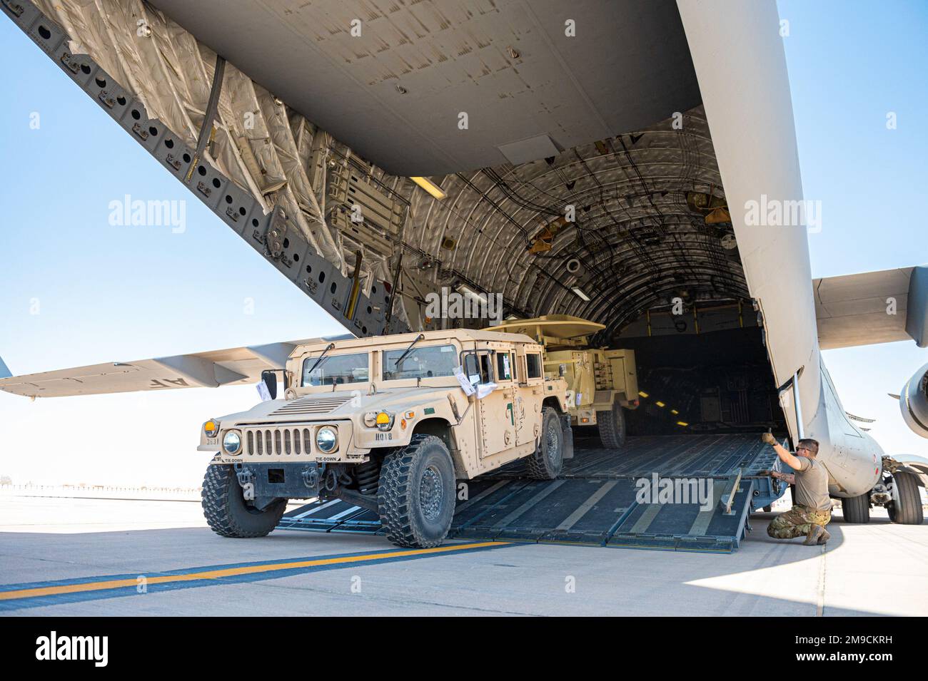 A U.S. Army satellite transportable terminal, towed by an M1165A1 multi ...