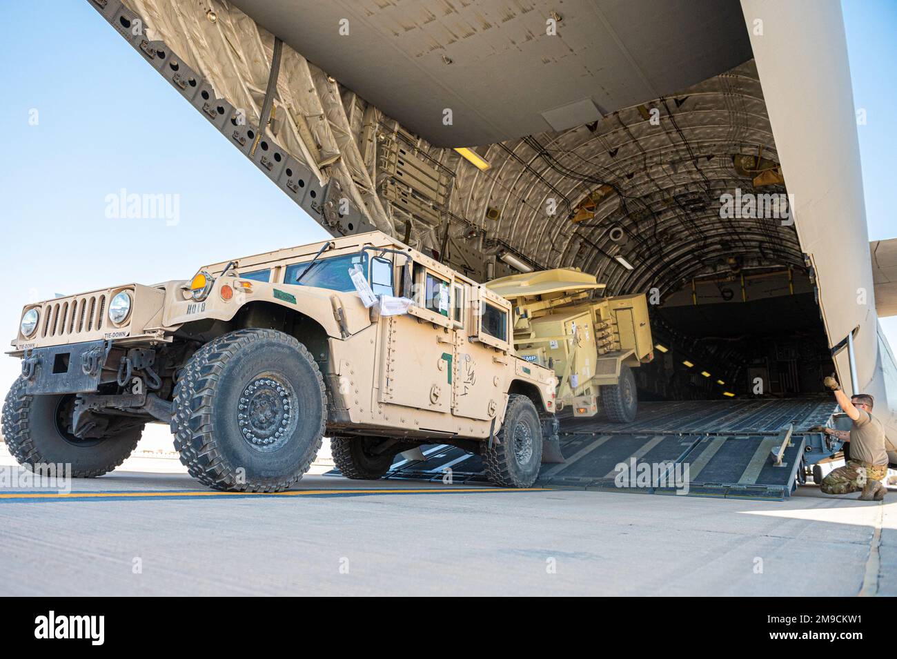 A U.S. Army satellite transportable terminal, towed by an M1165A1 multi ...