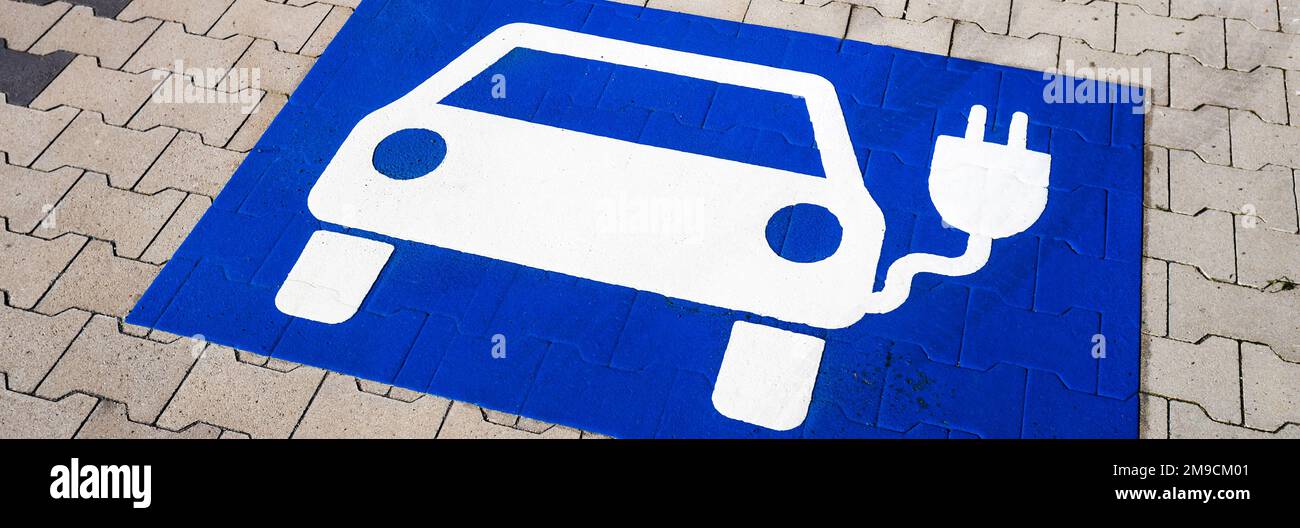 an electric car parking sign panorama Stock Photo - Alamy