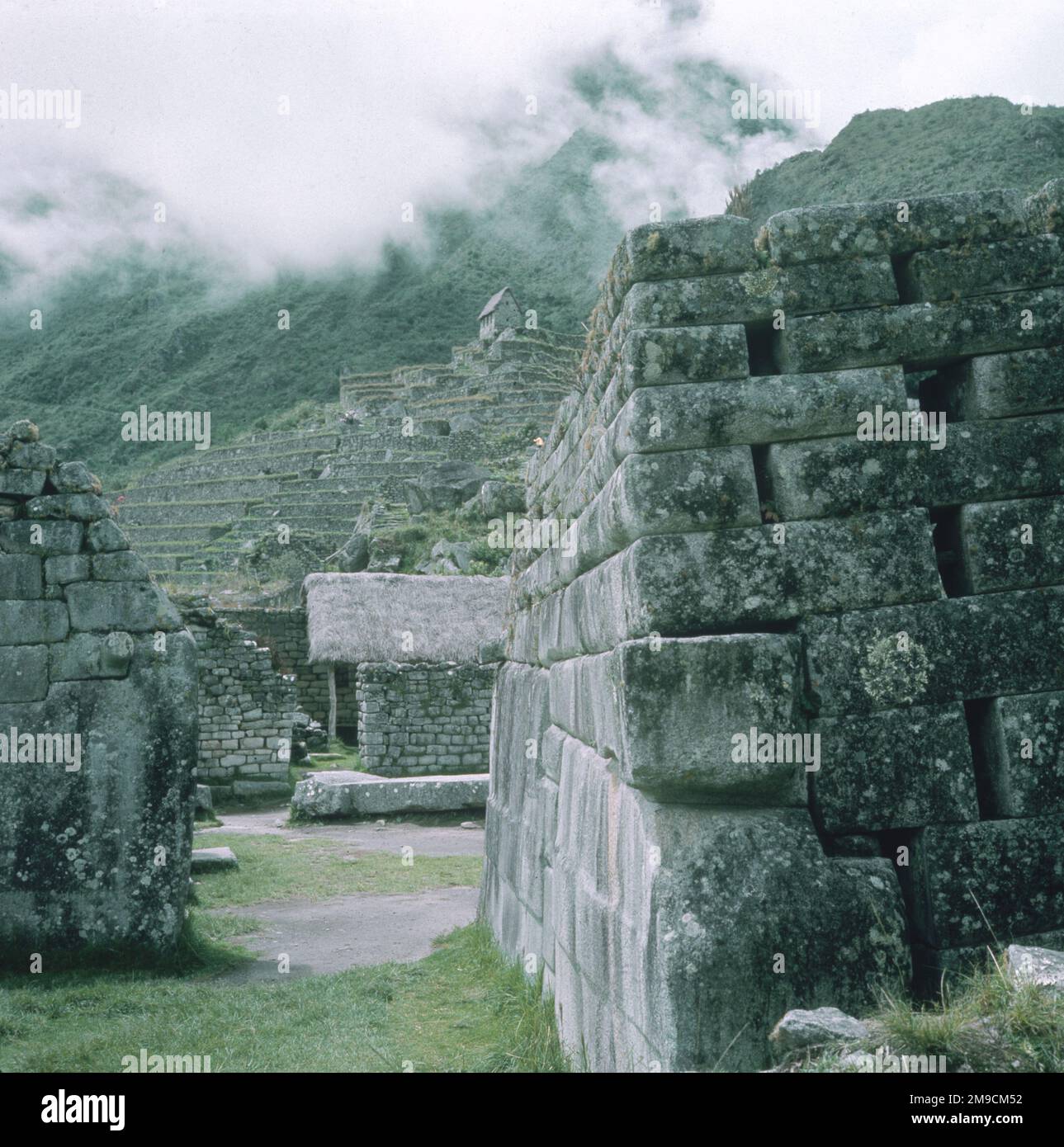Stone walls of the ancient Inca city, discovered by Hiram Bingham in ...