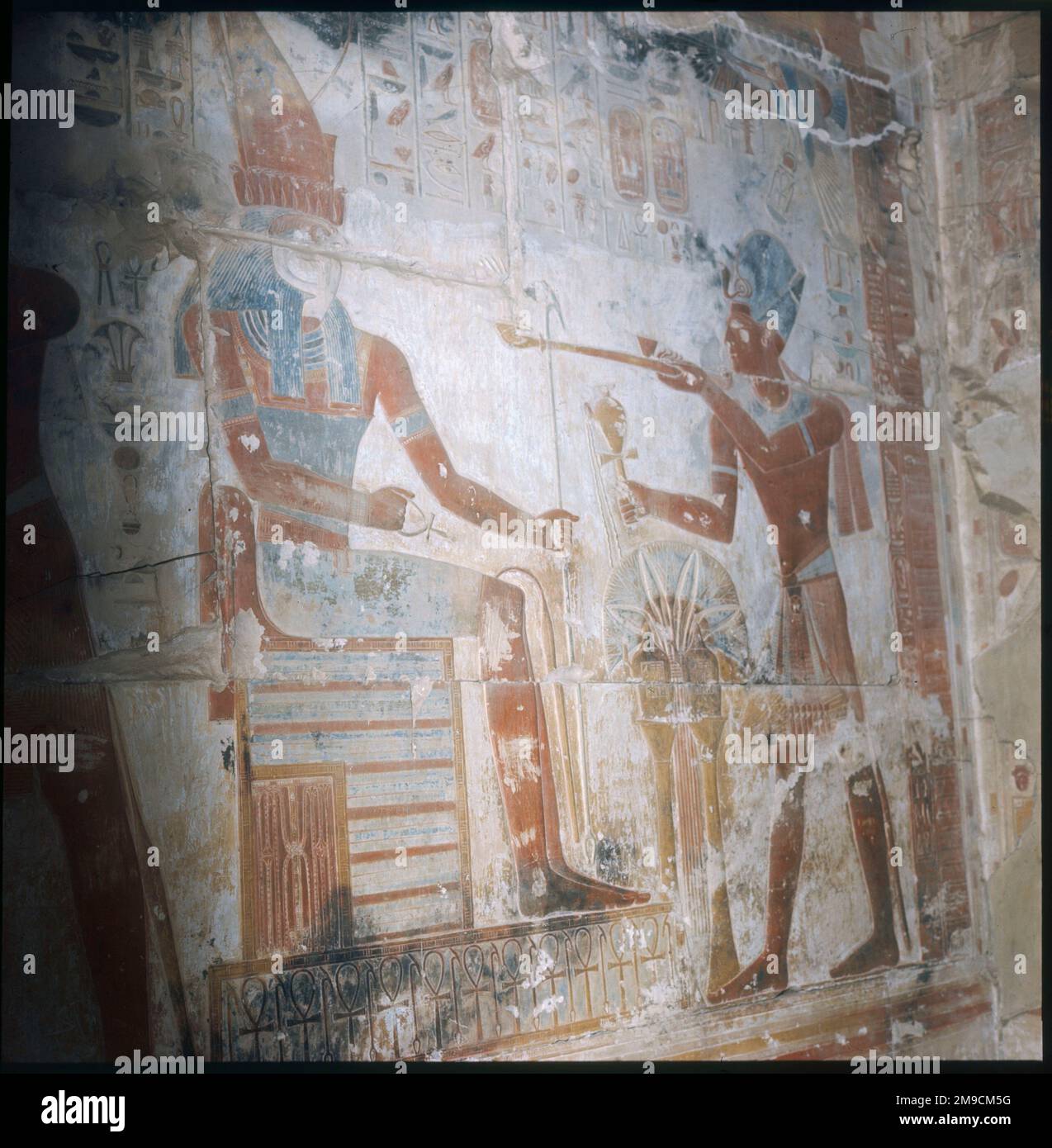 Horus receives an offering of incense from Seti I Wall-painting at ...