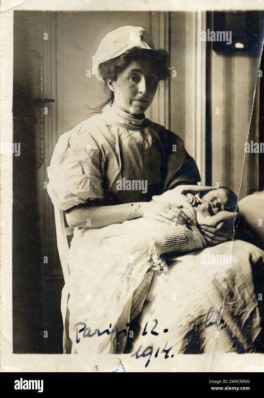 A midwife is photographed with a newborn baby Stock Photo - Alamy