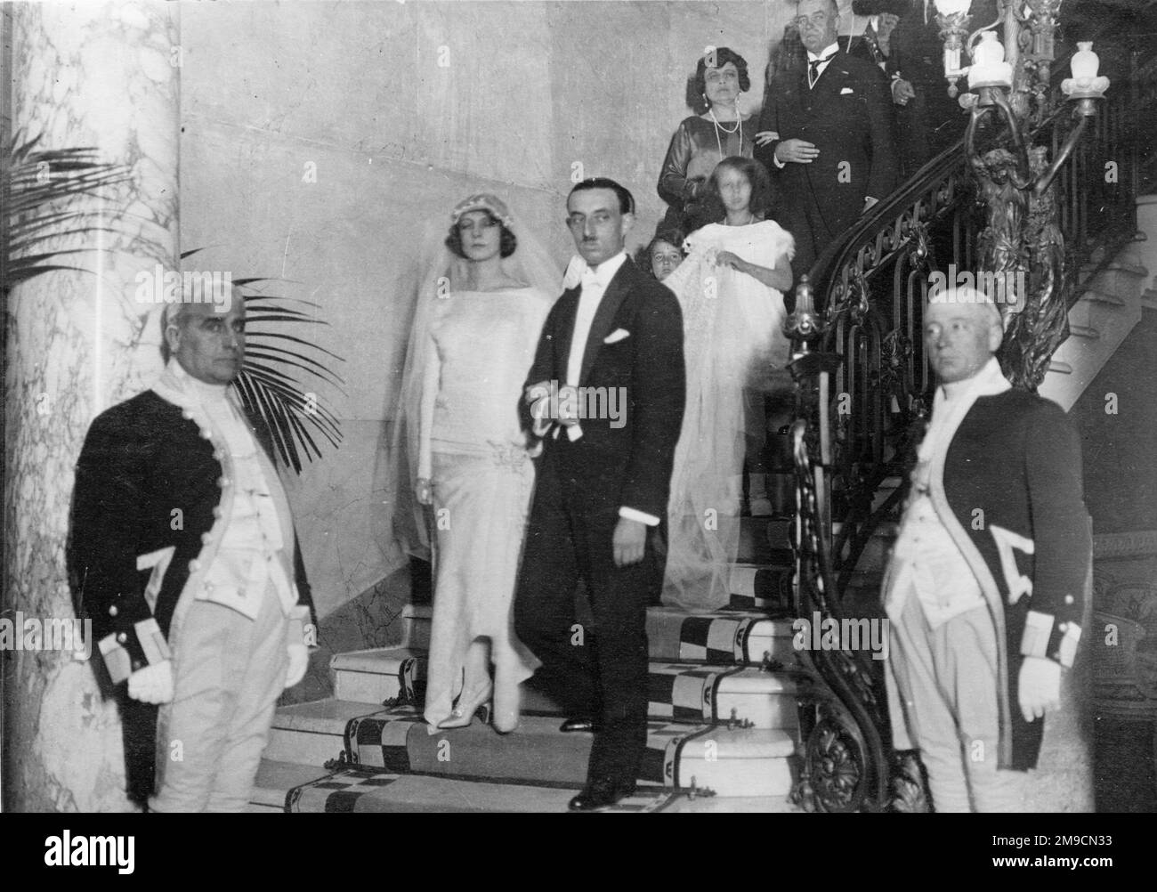 The bride and groom walk downstairs Stock Photo - Alamy