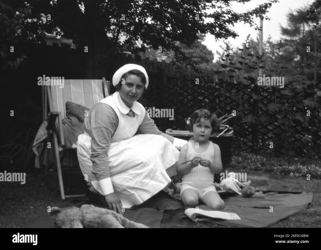 Little girl with her Nanny Stock Photo - Alamy