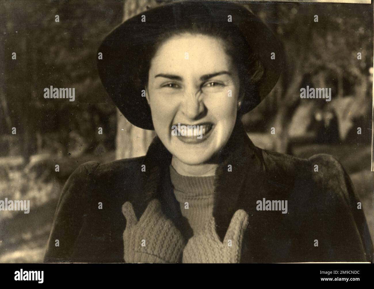 Photograph of a grinning woman Stock Photo - Alamy