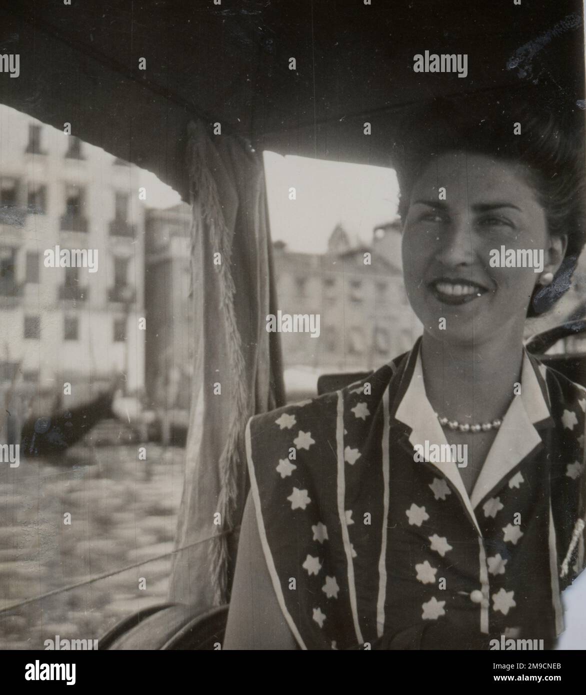 Woman taking a ride on a gondola Stock Photo - Alamy
