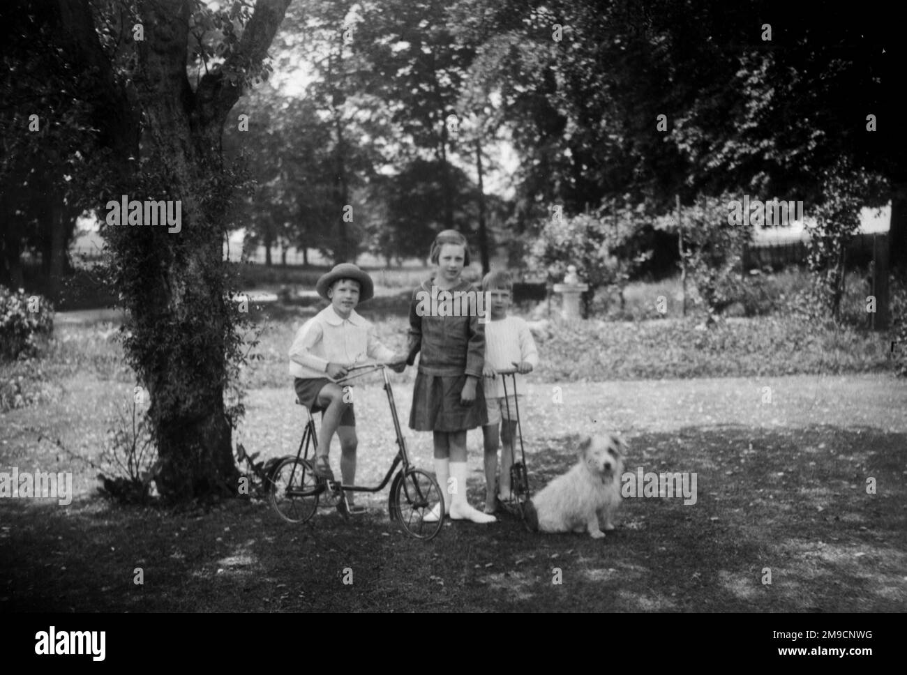 Girl on bike dog Black and White Stock Photos & Images - Alamy
