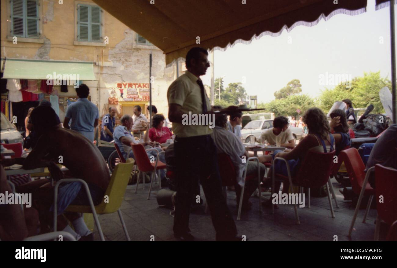 Scene at a street cafe in Corfu, Greece Stock Photo - Alamy
