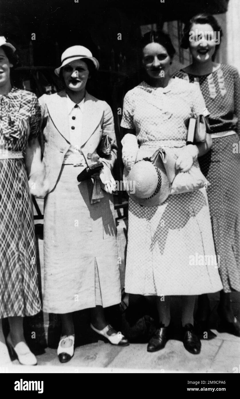 Photograph of four smartly-dressed ladies in strong sunlight Stock ...