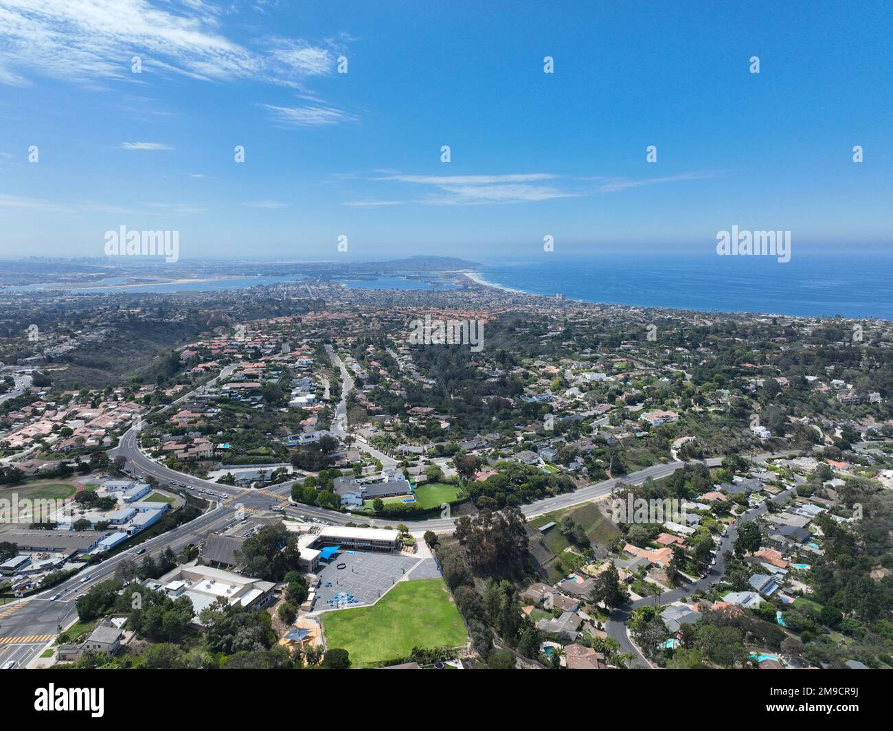 Aerial view over La Jolla Hills with big villas and ocean in the ...