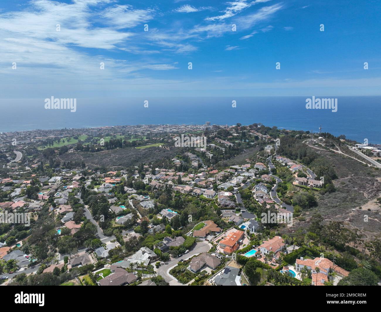 Aerial view over La Jolla Hills with big villas and ocean in the ...