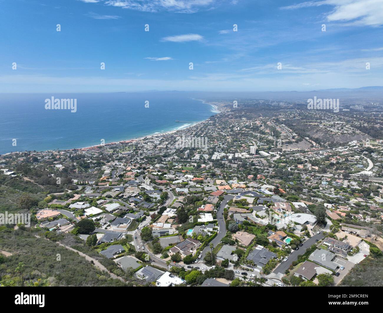 Aerial view over La Jolla Hills with big villas and ocean in the ...