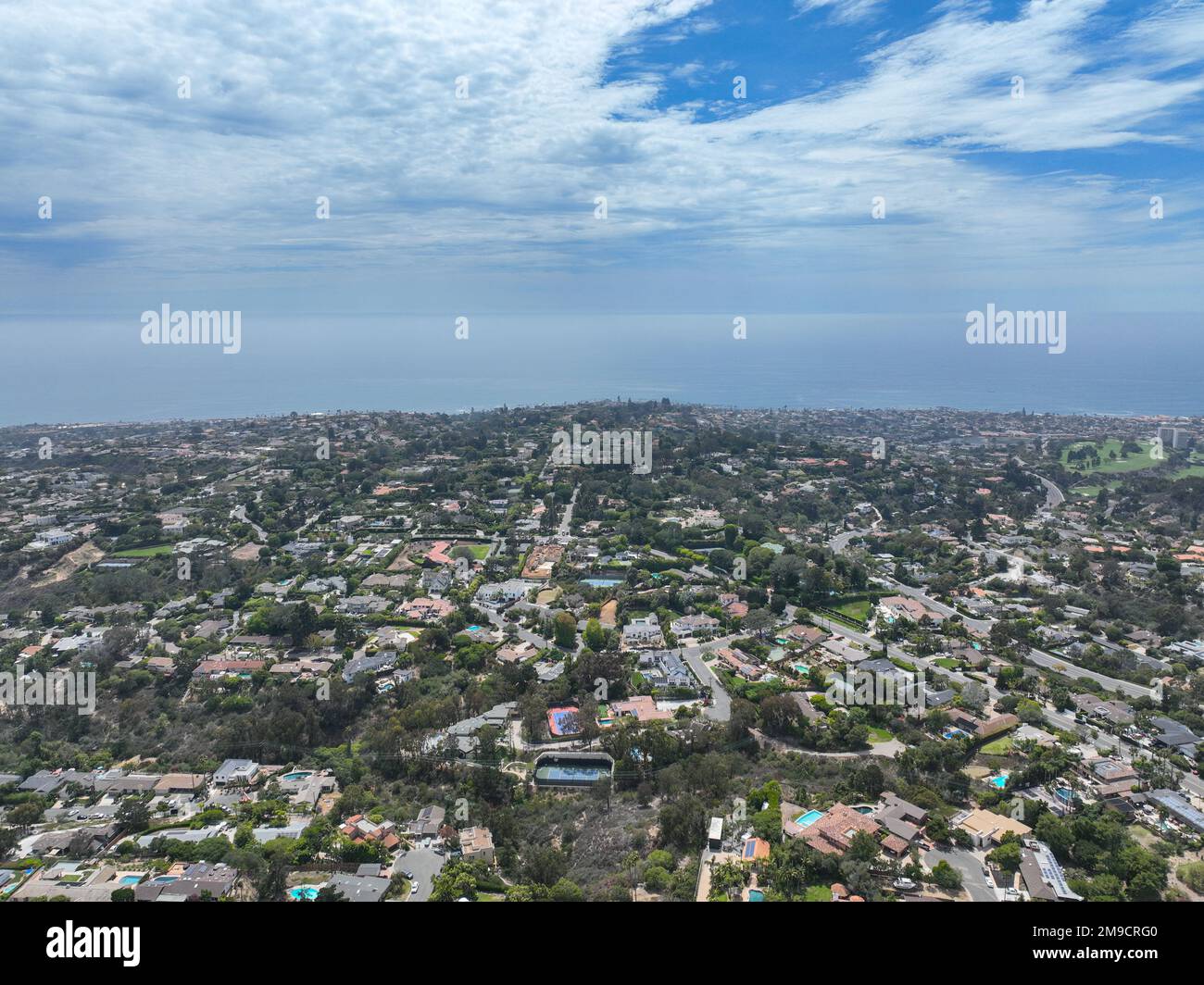 Aerial view over La Jolla Hills with big villas and ocean in the ...
