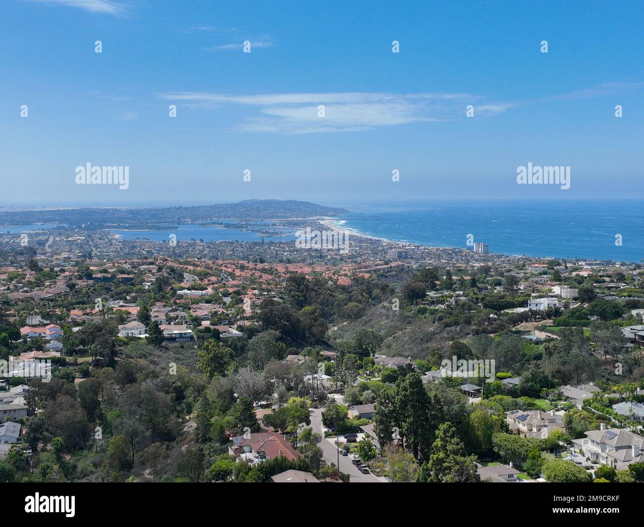 Aerial view over La Jolla Hills with big villas and ocean in the ...