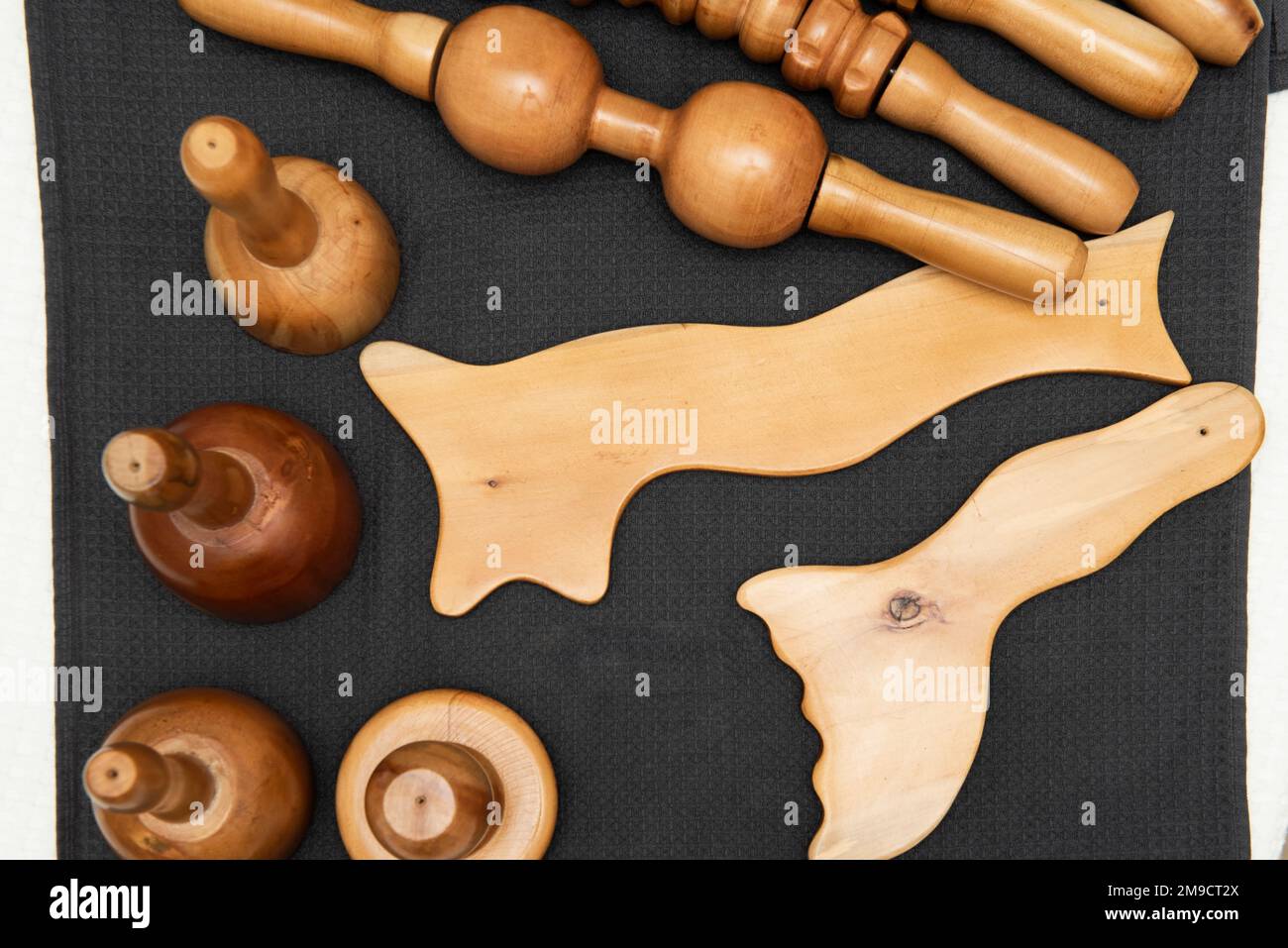 Massage table with interchangeable paper rollers and wood therapy parts ...