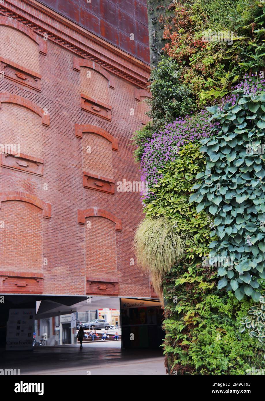 Madrid, Spain - May 2018: Vertical garden wall and Brick facade of ...