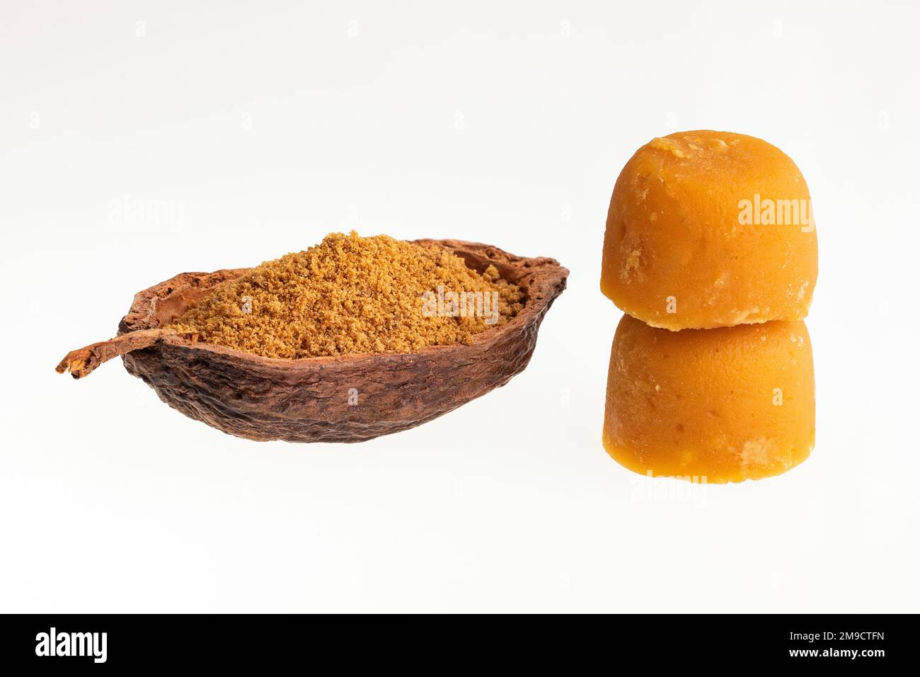 Panela in block and powder - Sugar cane candy Stock Photo - Alamy