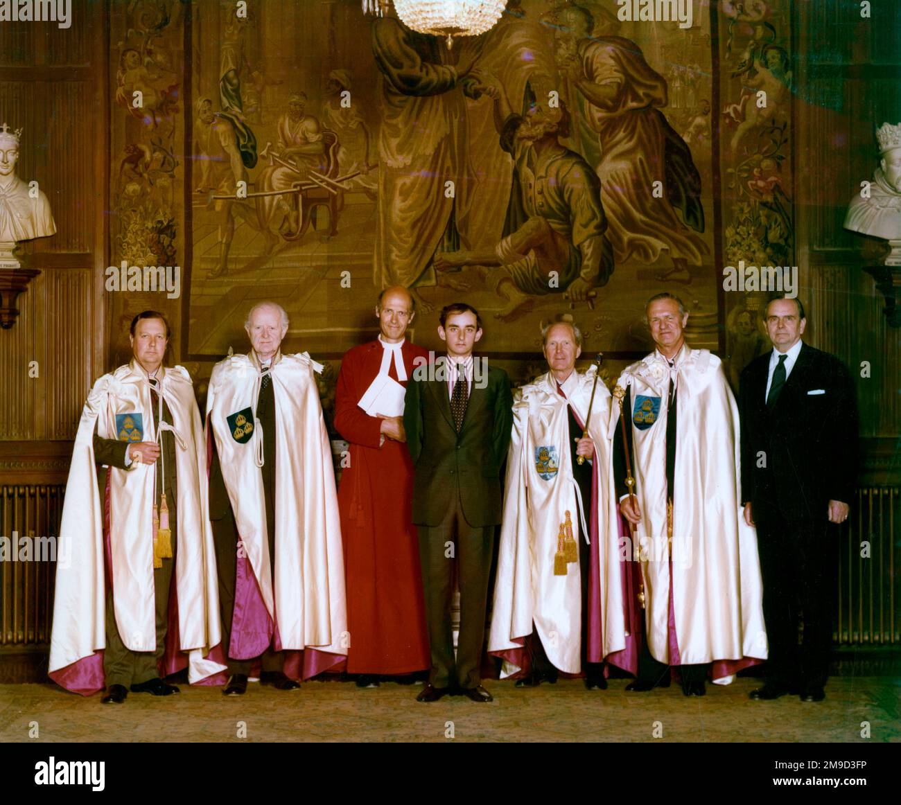 Group photo of seven people, four of them in official robes, taking ...