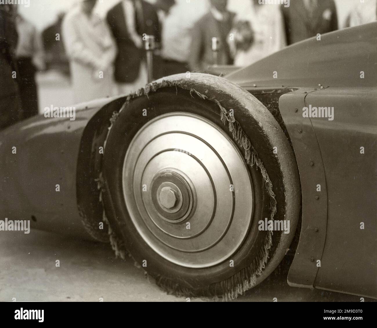 View of a shredded tyre with hubcap on Blue Bird Stock Photo - Alamy
