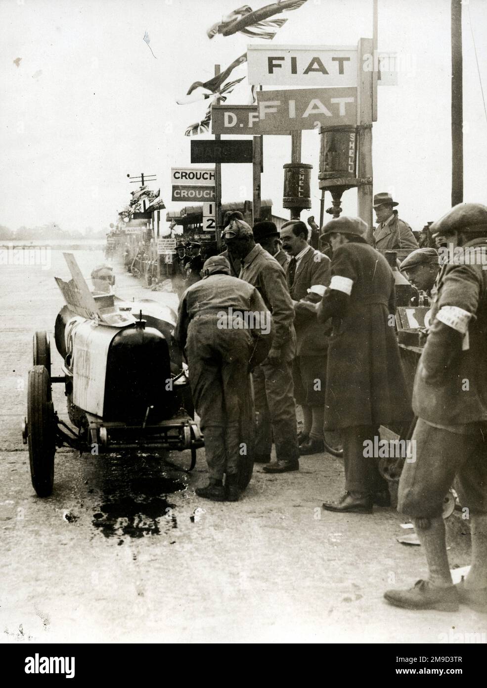 Salamano and mechanic inspecting car after Campbell retires from 200 ...