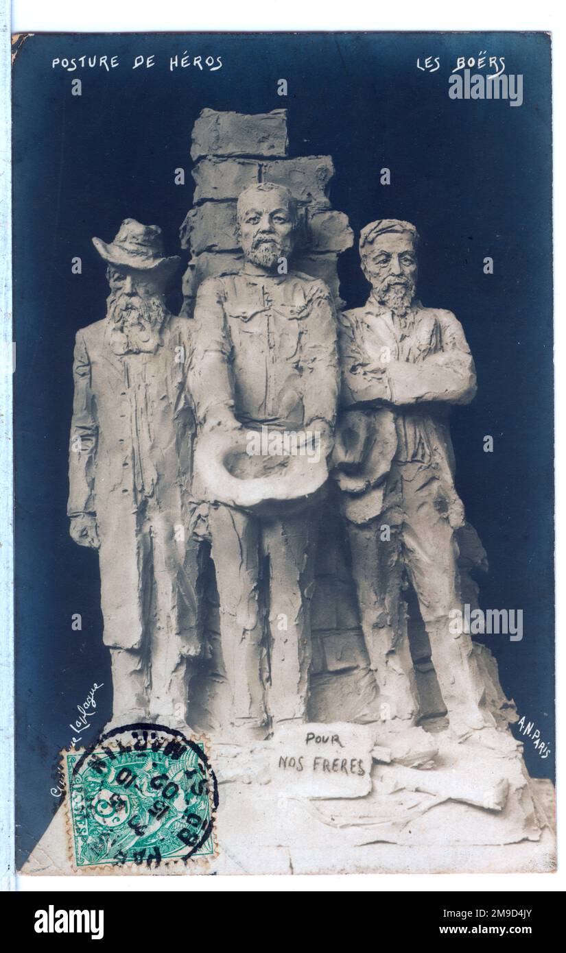 Three Boer statue figures stand together. The middle one is holding out ...