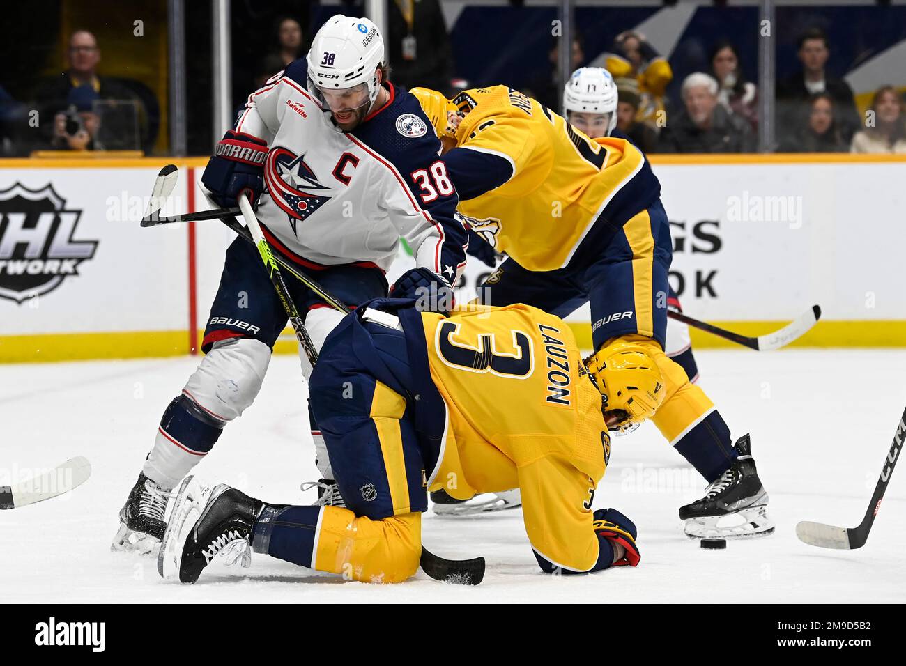 Columbus Blue Jackets center Boone Jenner (38) and Nashville Predators defenseman Jeremy Lauzon ...