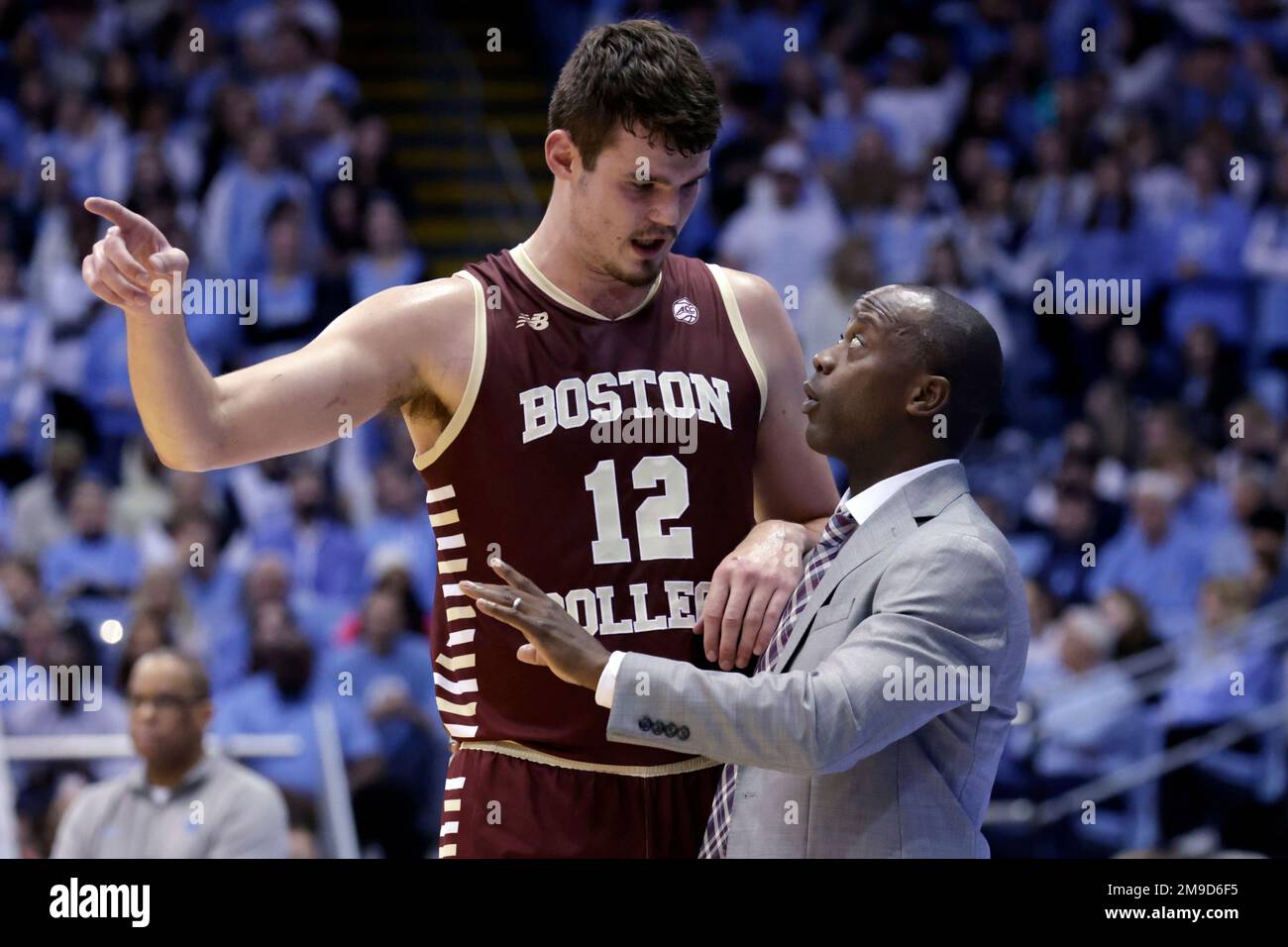 Boston College forward Quinten Post (12) confers with head coach Earl ...