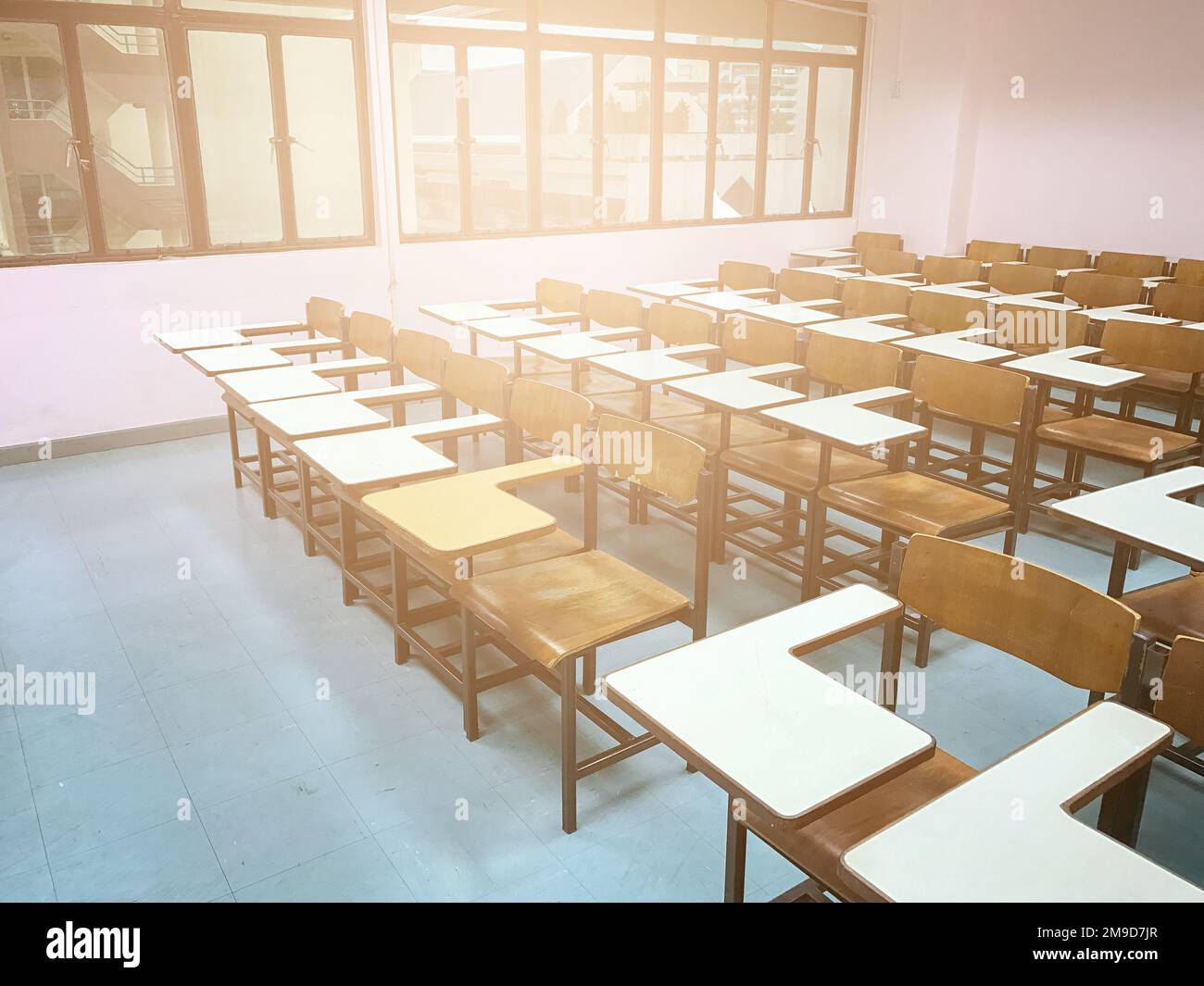 Wooden chairs in the classroom background Stock Photo - Alamy