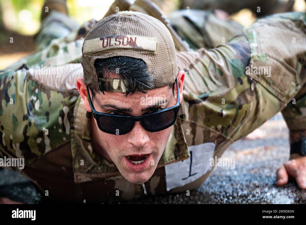 An Airman assigned to the 20th Fighter Wing performs push-ups during ...