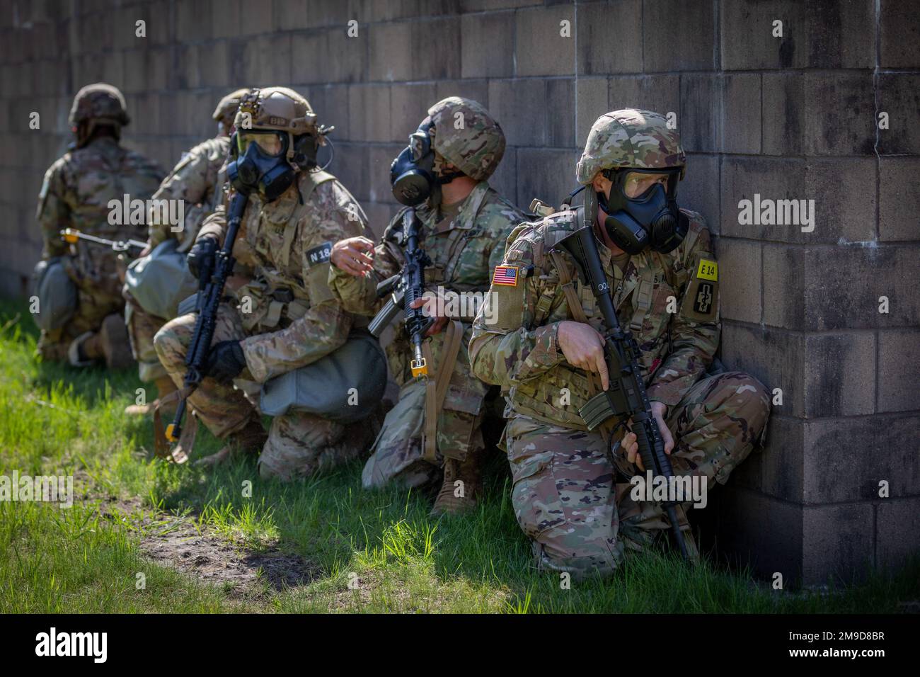 Competitor Squad 1 takes cover behind a wall at the Combined Arms ...