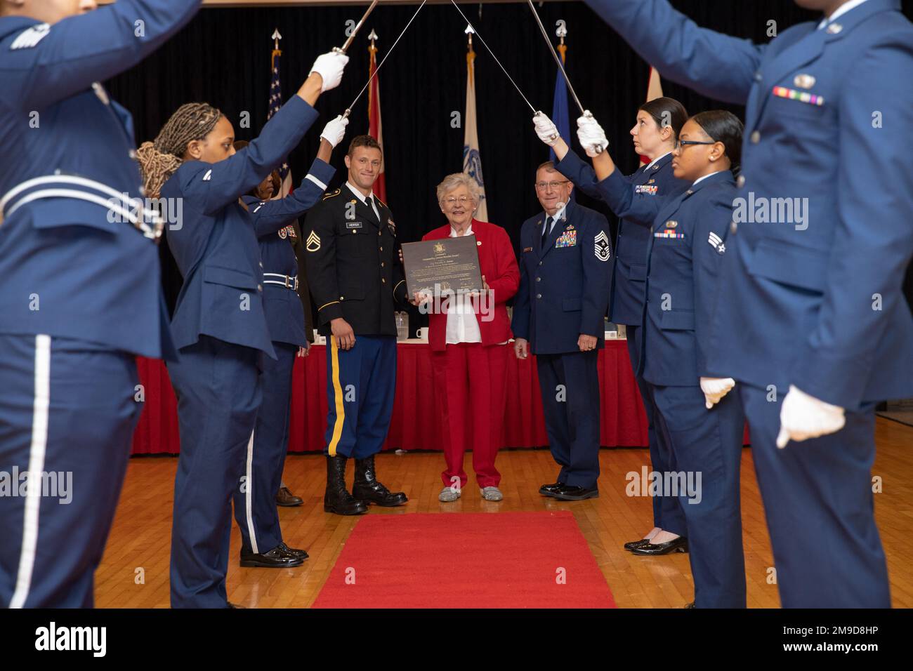 Kay Ivey, Alabama goveror, presents Staff Sgt. Timothy Herter with the ...