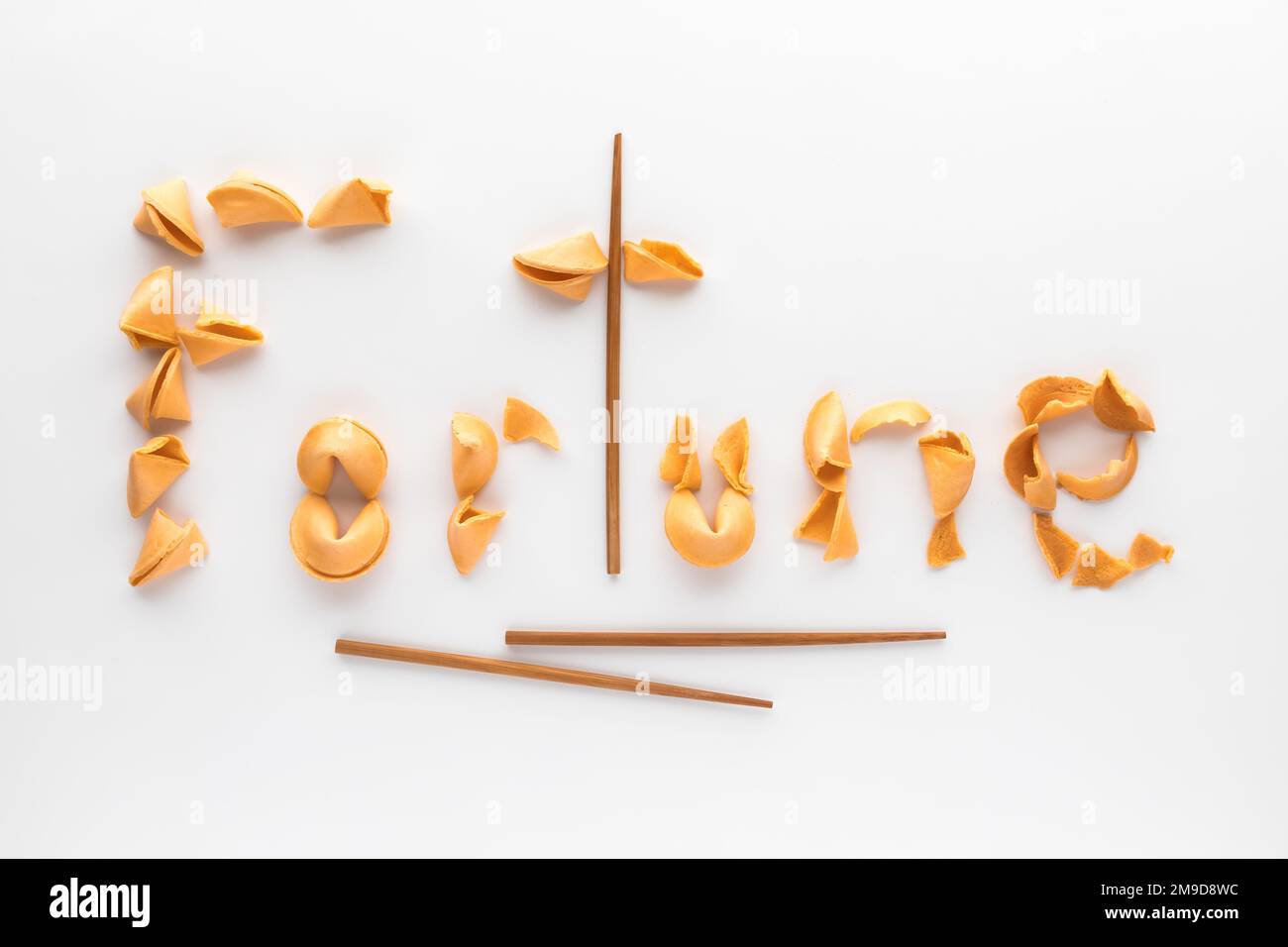 Fortune cookies and chopsticks used to spell the word fortune Stock ...