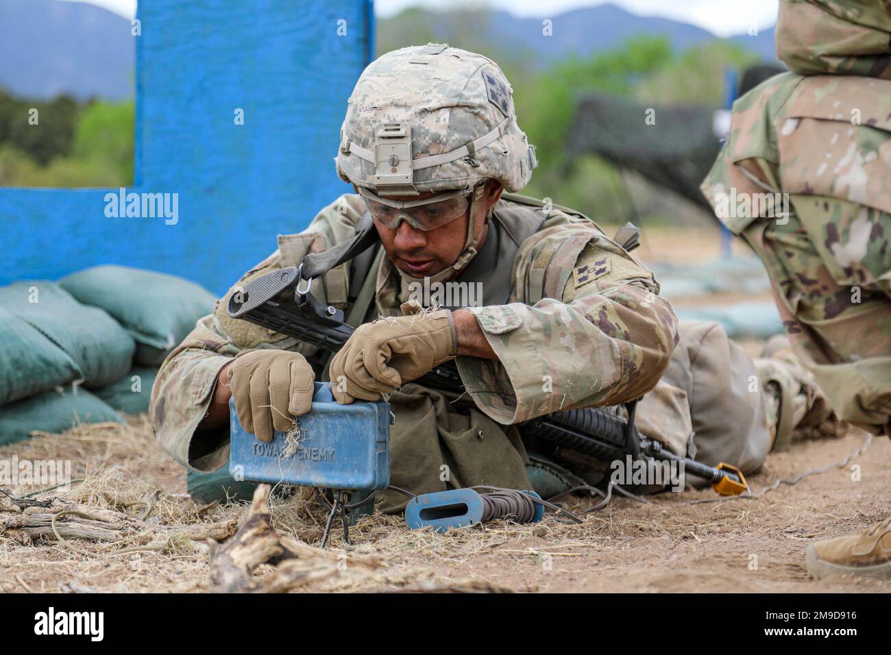 A soldier assigned to the 4th Infantry Division employs a claymore mine ...
