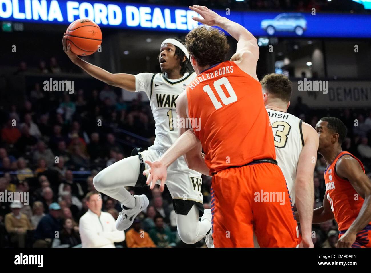 Wake Forest guard Tyree Appleby (1) drives past Clemson forward Ben ...