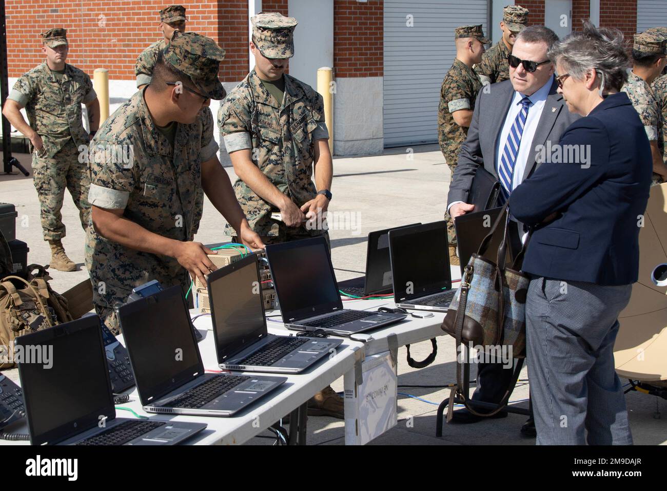 U.S. Marine Corps Lance Cpl. Jose Guardado (left center), a network ...