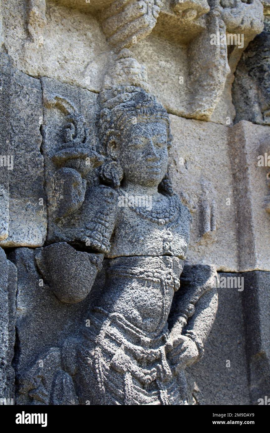 Detailed statues on Plaosan temple wall in Java, Indonesia. Taken in ...