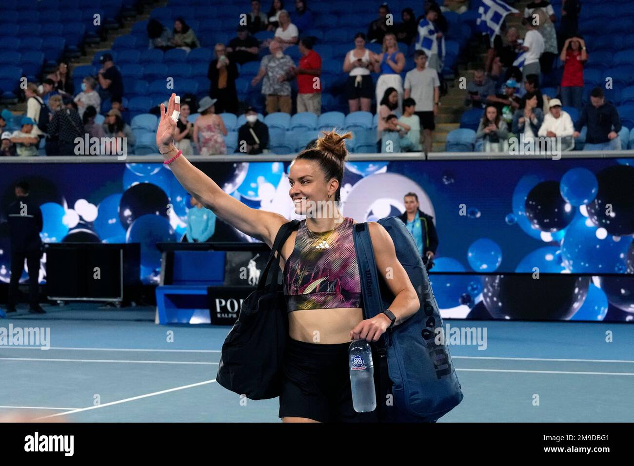 Maria Sakkari of Greece waves as she leaves the court following her second round match against ...