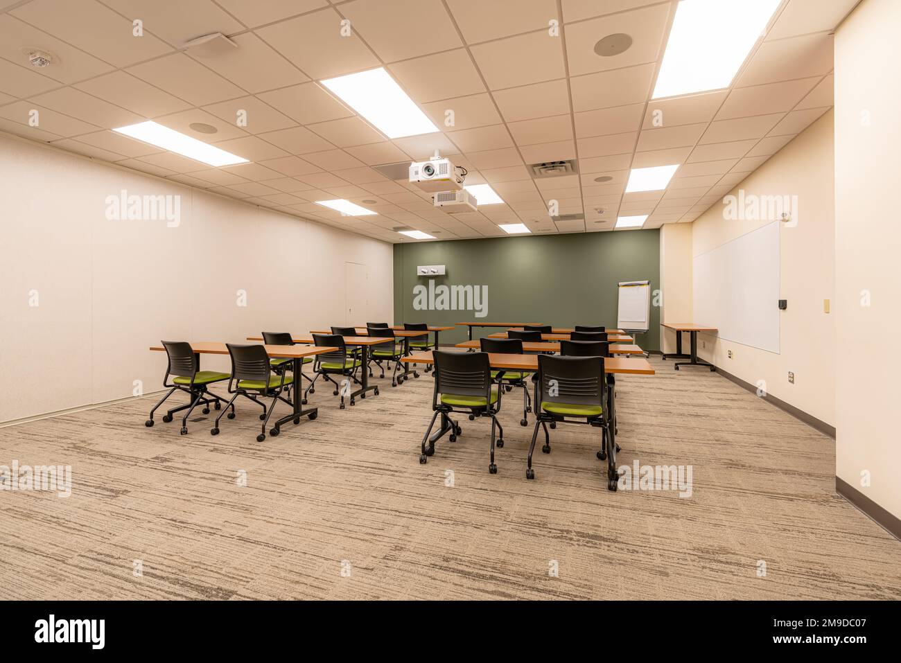 Interior of an office training, meeting, conference room with desks ...