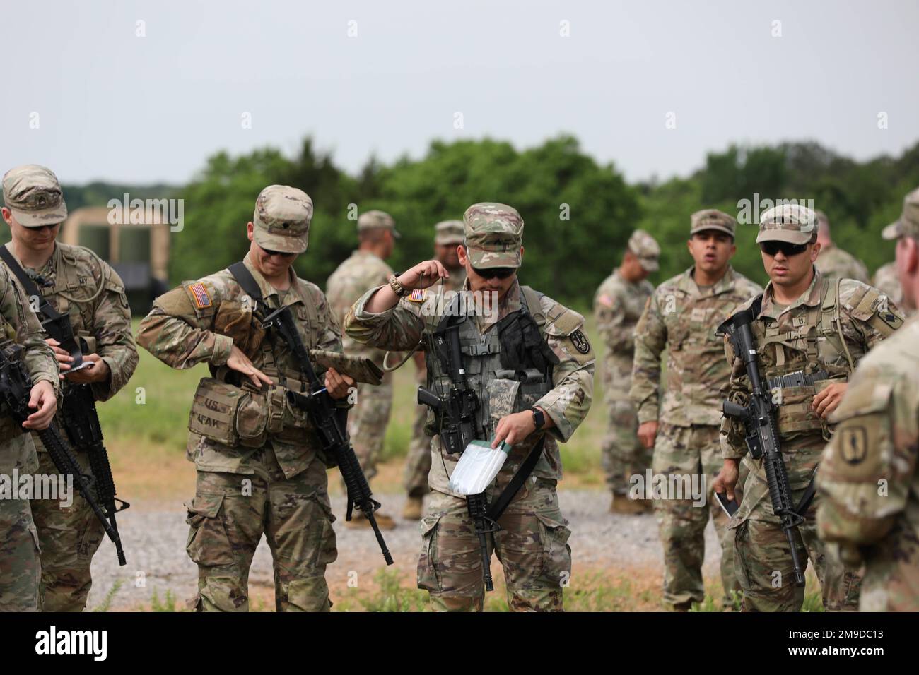 Army National Guard Soldiers prepare their equipment before ...
