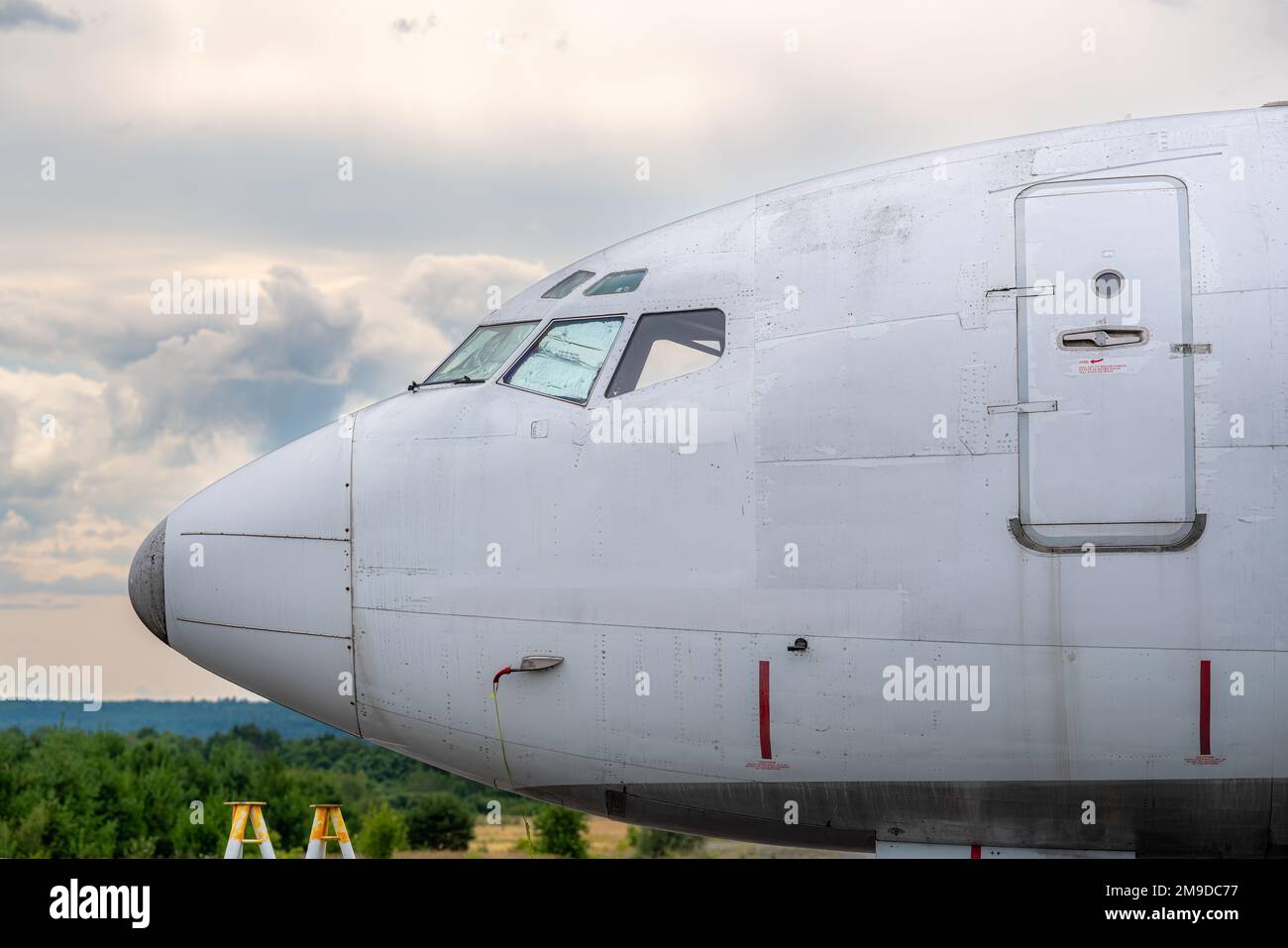 Side view close up the nose and cockpit of an old passenger jet, plane ...