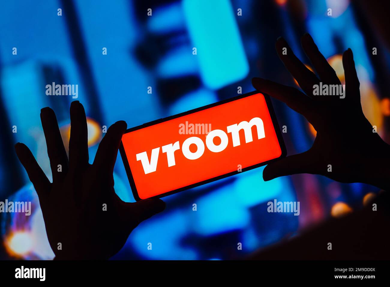 In this photo illustration, the Vroom, Inc. logo is displayed on a ...