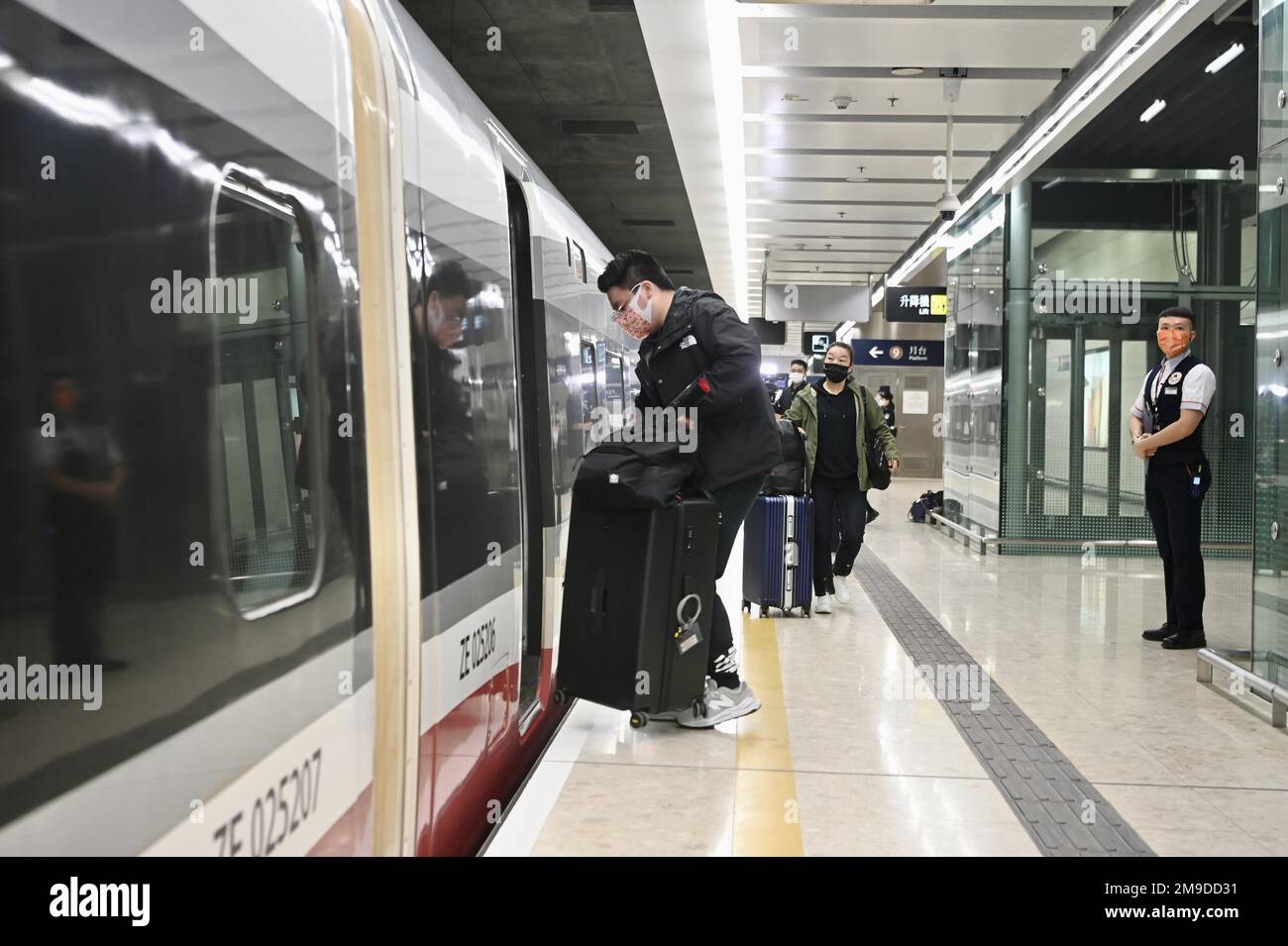 **CHINESE MAINLAND, HONG KONG, MACAU AND TAIWAN OUT** Passengers get on ...