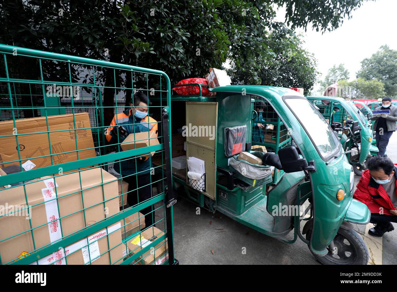 ZIXING, CHINA - JANUARY 17, 2023 - Staff members sort express parcels ...